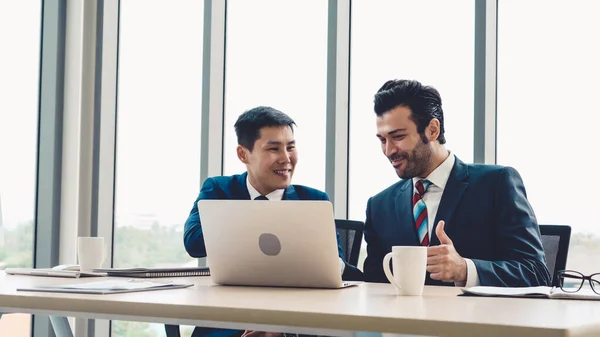 Two business people talk project strategy at office - Stock Image ...
