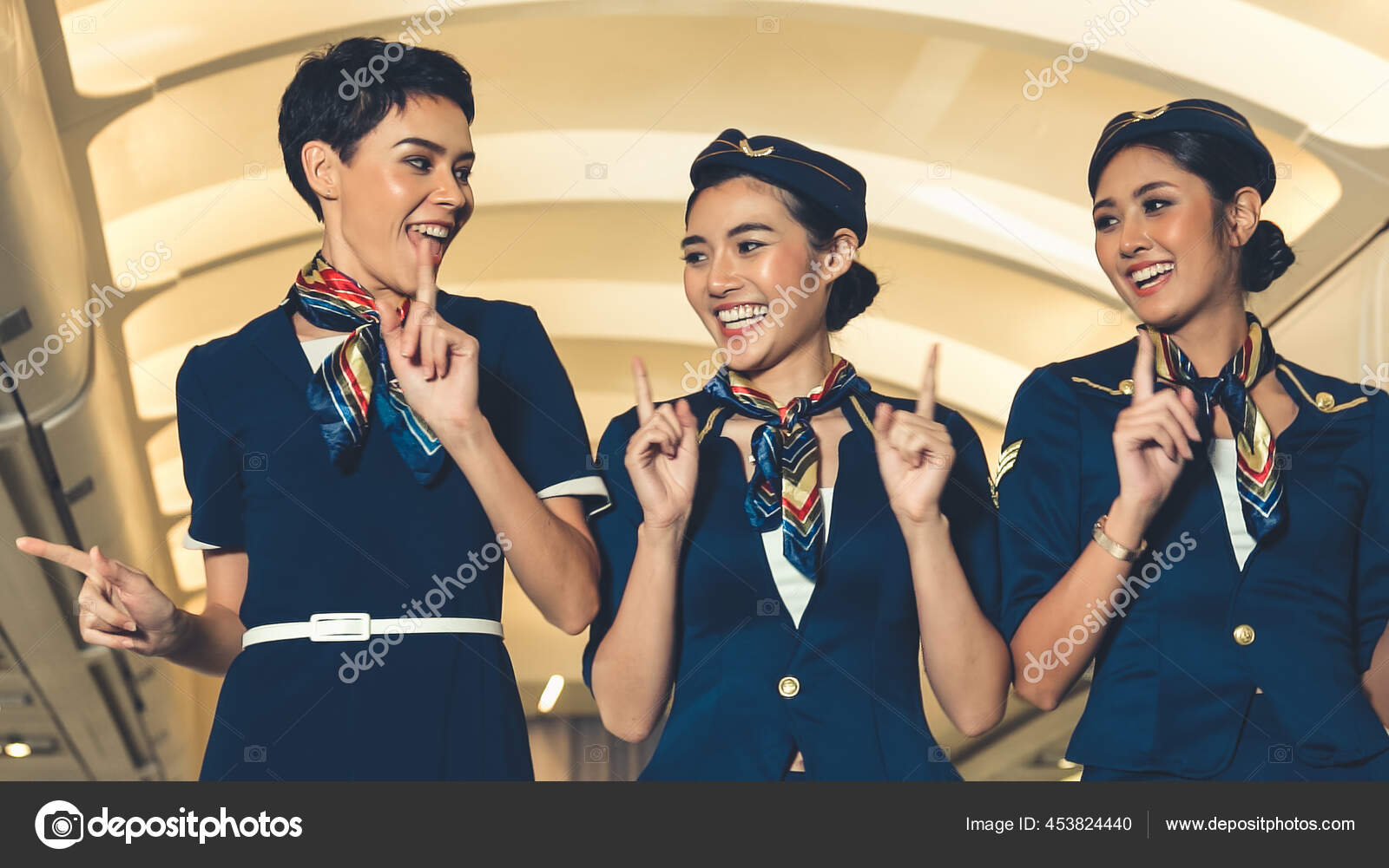 Cabin crew dancing with joy in airplane — Stock Photo © BiancoBlue ...